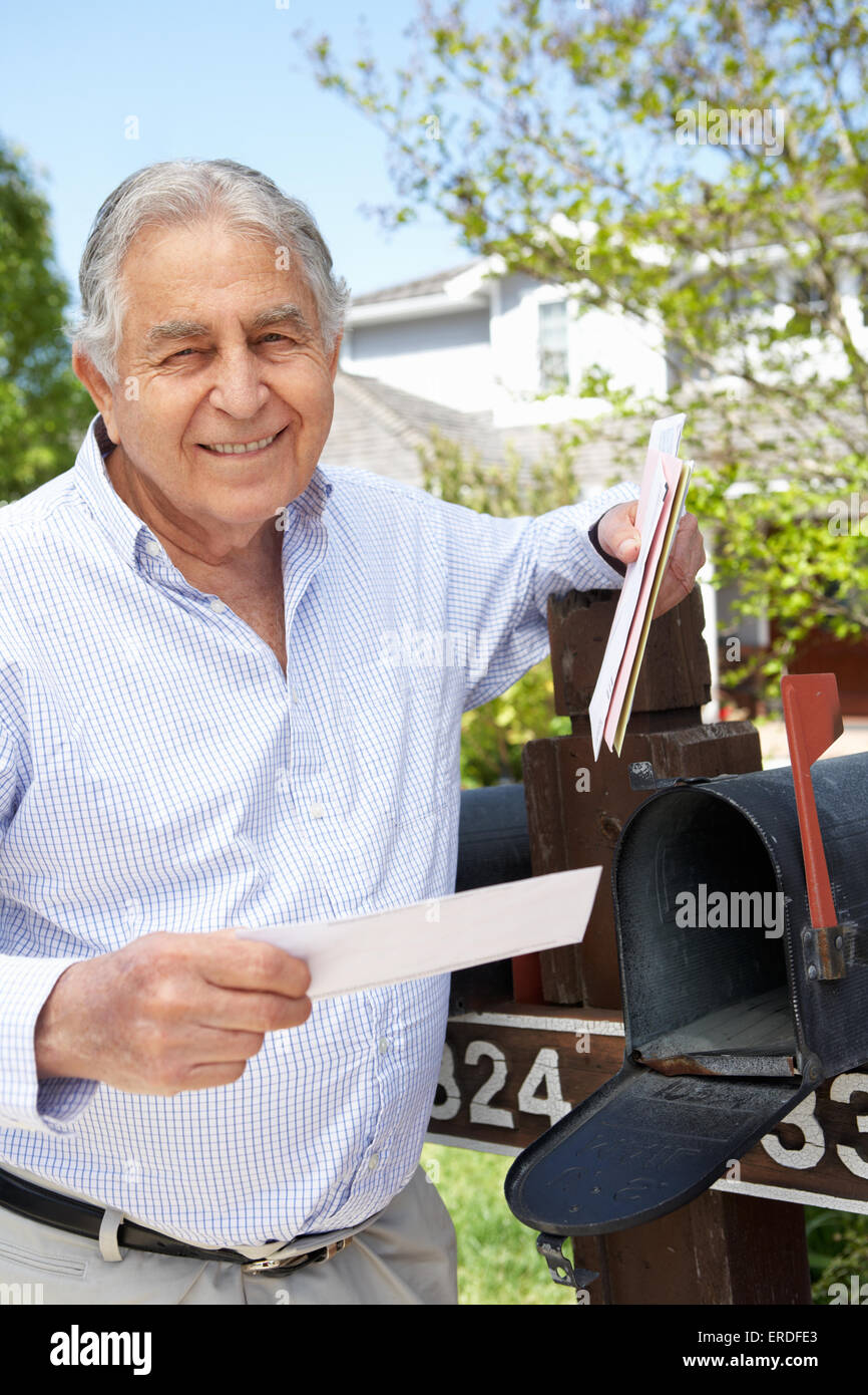 Senior Hispanic Man Checking Mailbox Stock Photo - Alamy