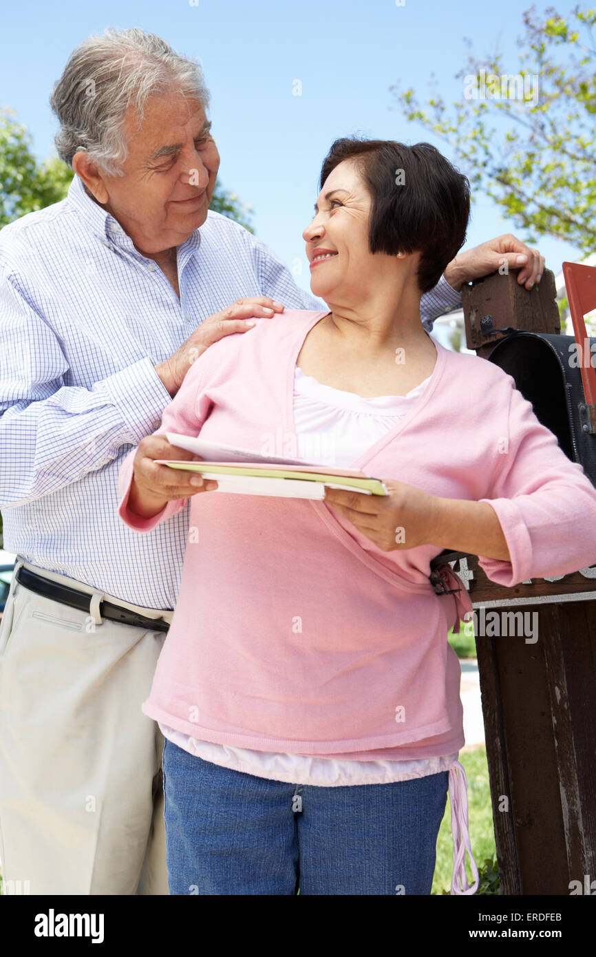 Senior Hispanic Couple Checking Mailbox Stock Photo - Alamy