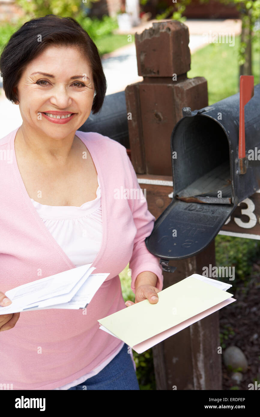 Senior Hispanic Woman Checking Mailbox Stock Photo - Alamy
