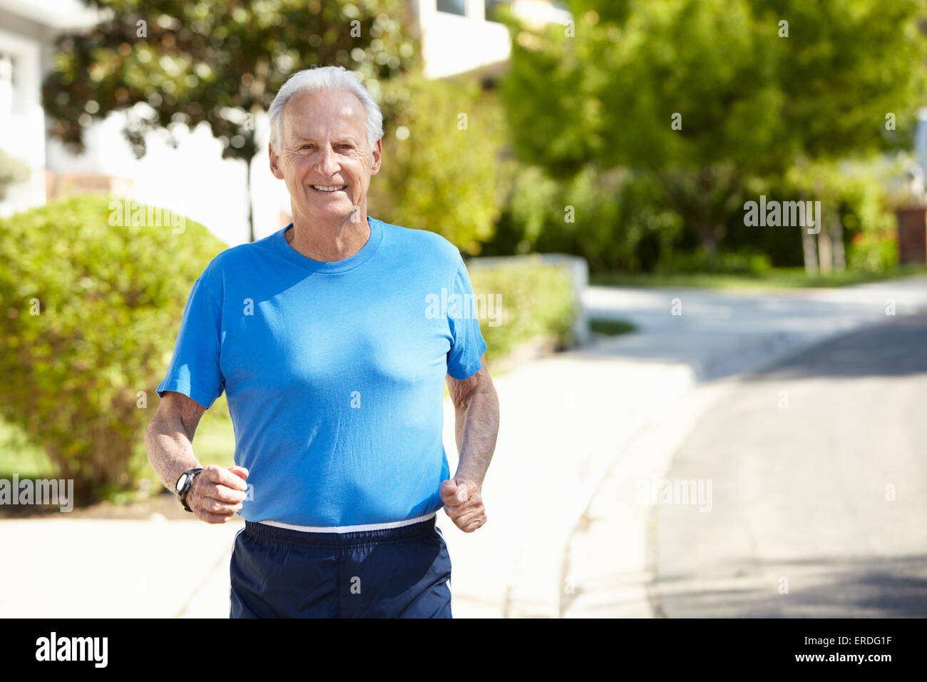 Elderly man jogging Stock Photo - Alamy