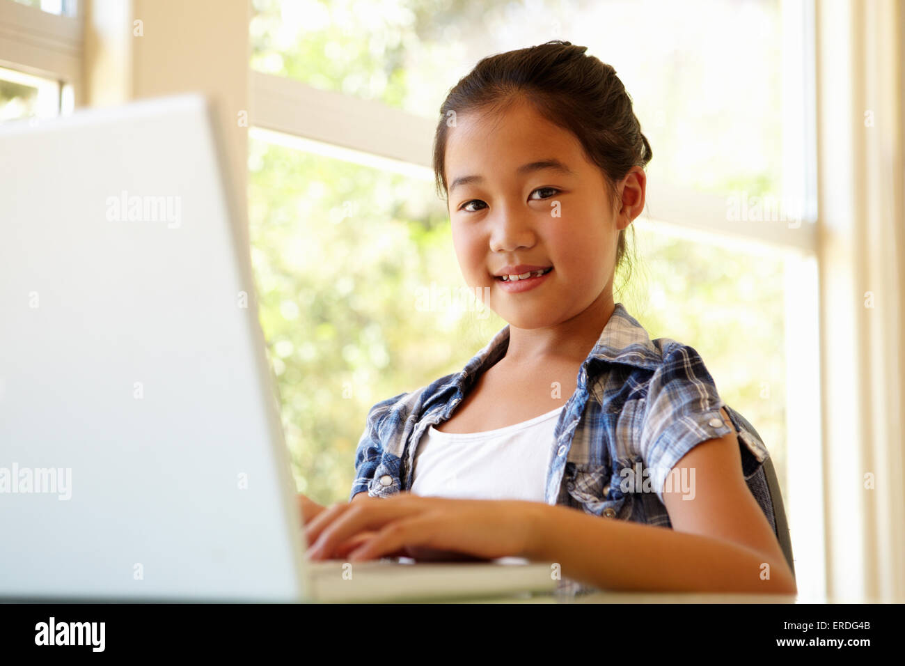 Young girl using laptop Stock Photo - Alamy