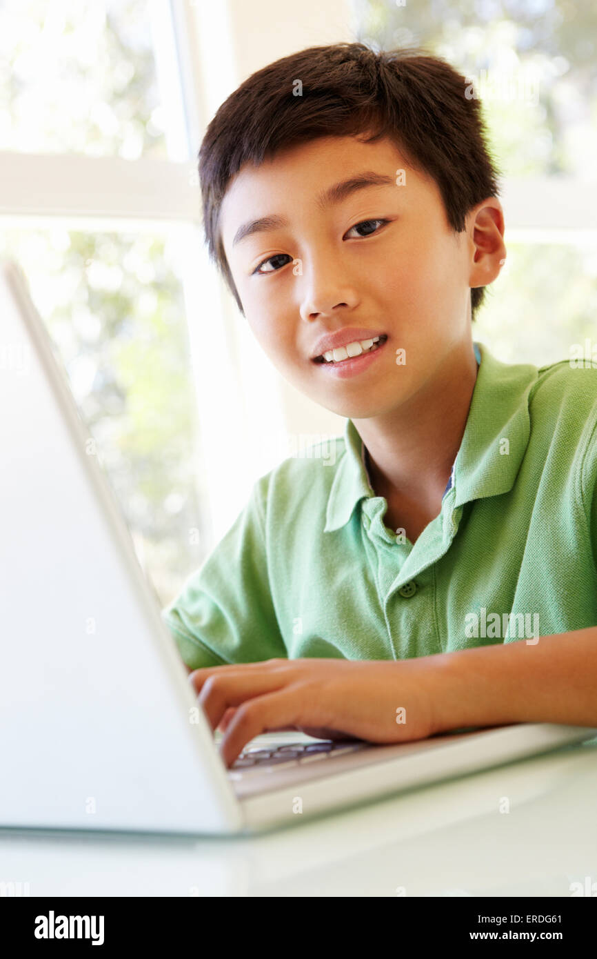Young Asian boy using laptop Stock Photo - Alamy