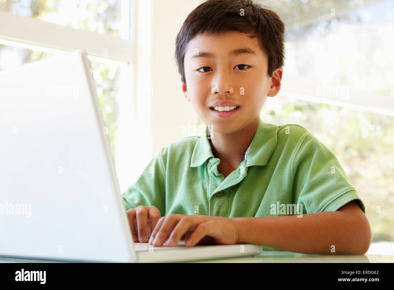 Asian teen boy typing hi-res stock photography and images - Alamy