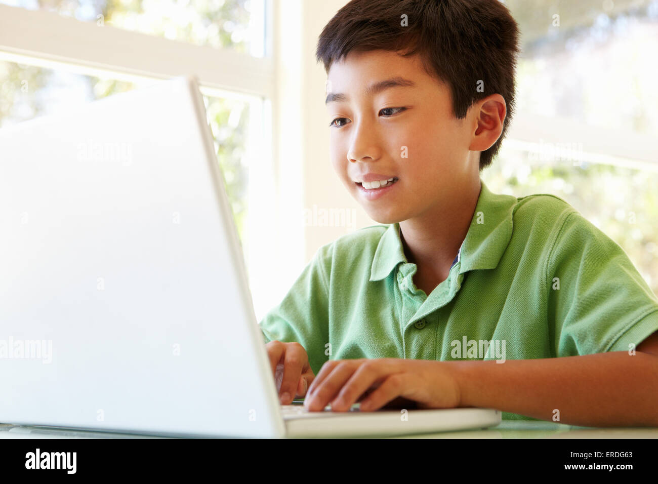 Asian teen boy typing hi-res stock photography and images - Alamy