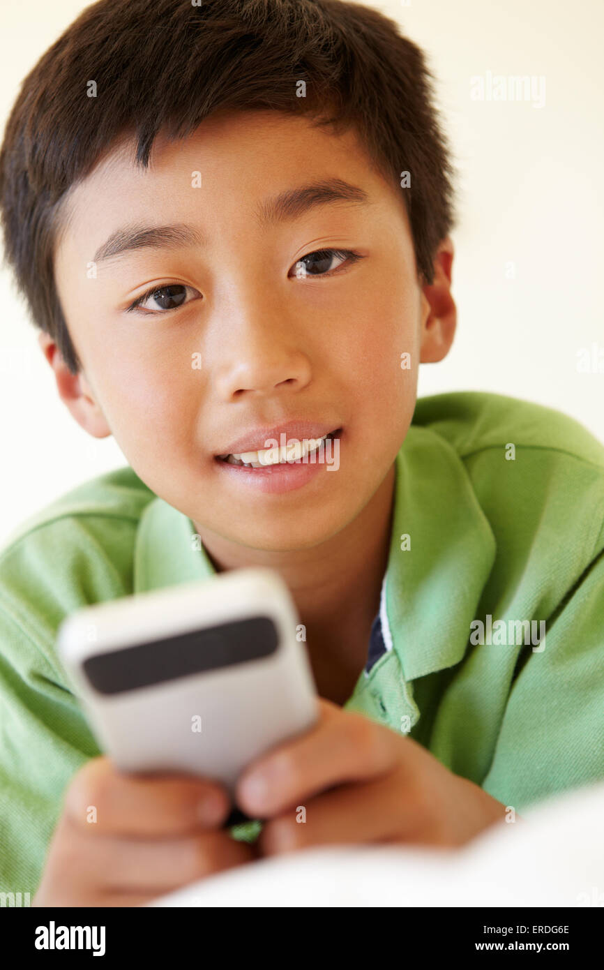 Young boy using smartphone Stock Photo - Alamy
