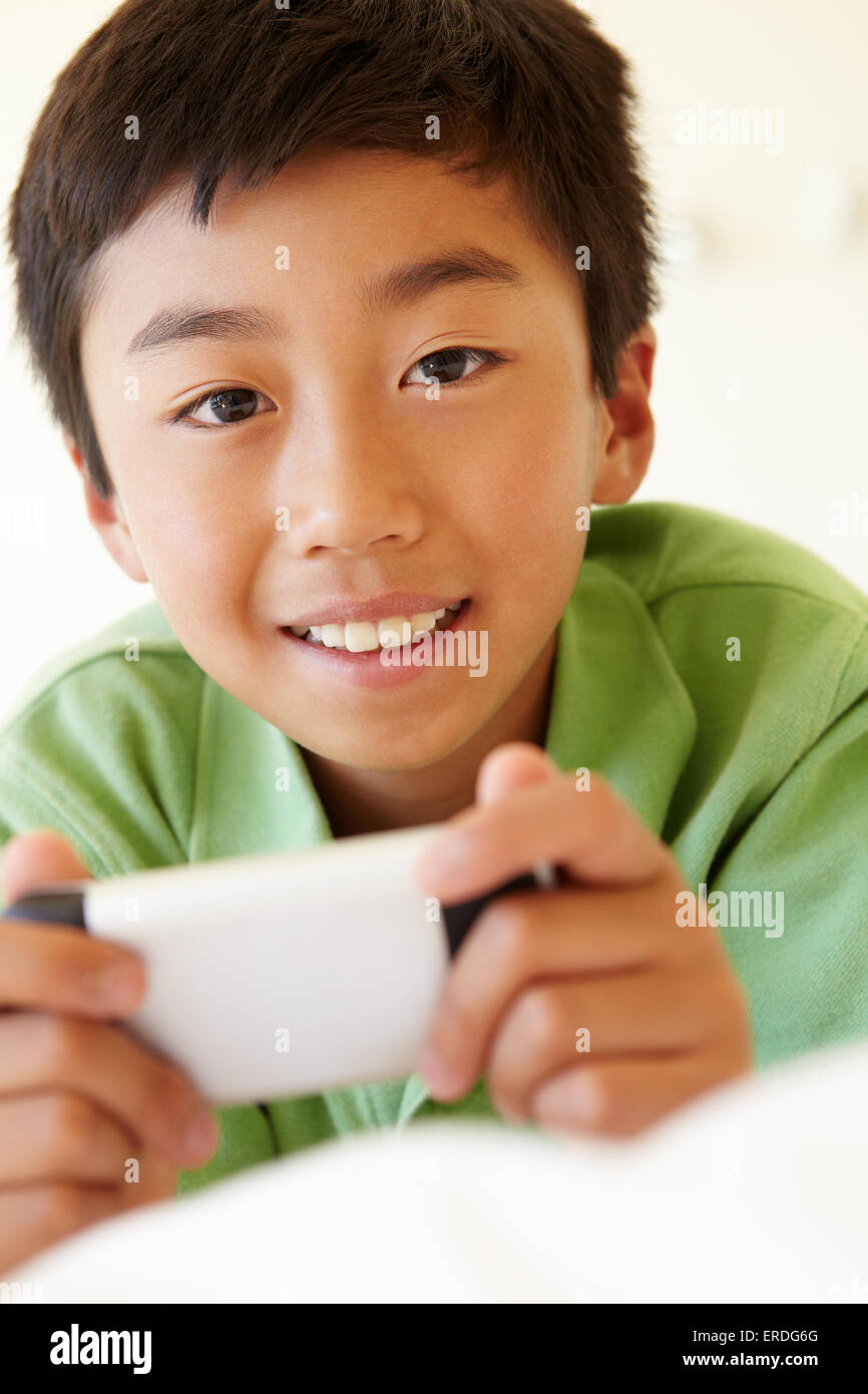Young boy using smartphone Stock Photo - Alamy