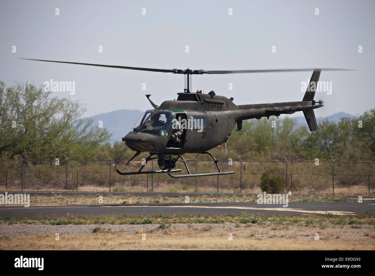 An OH-58 Kiowa helicopter of the U.S. Army landing at Pinal Airpark ...