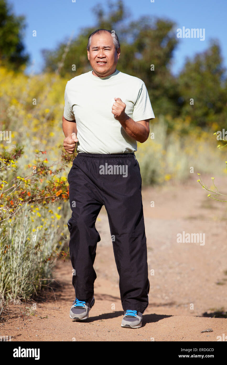 Senior man jogging Stock Photo - Alamy