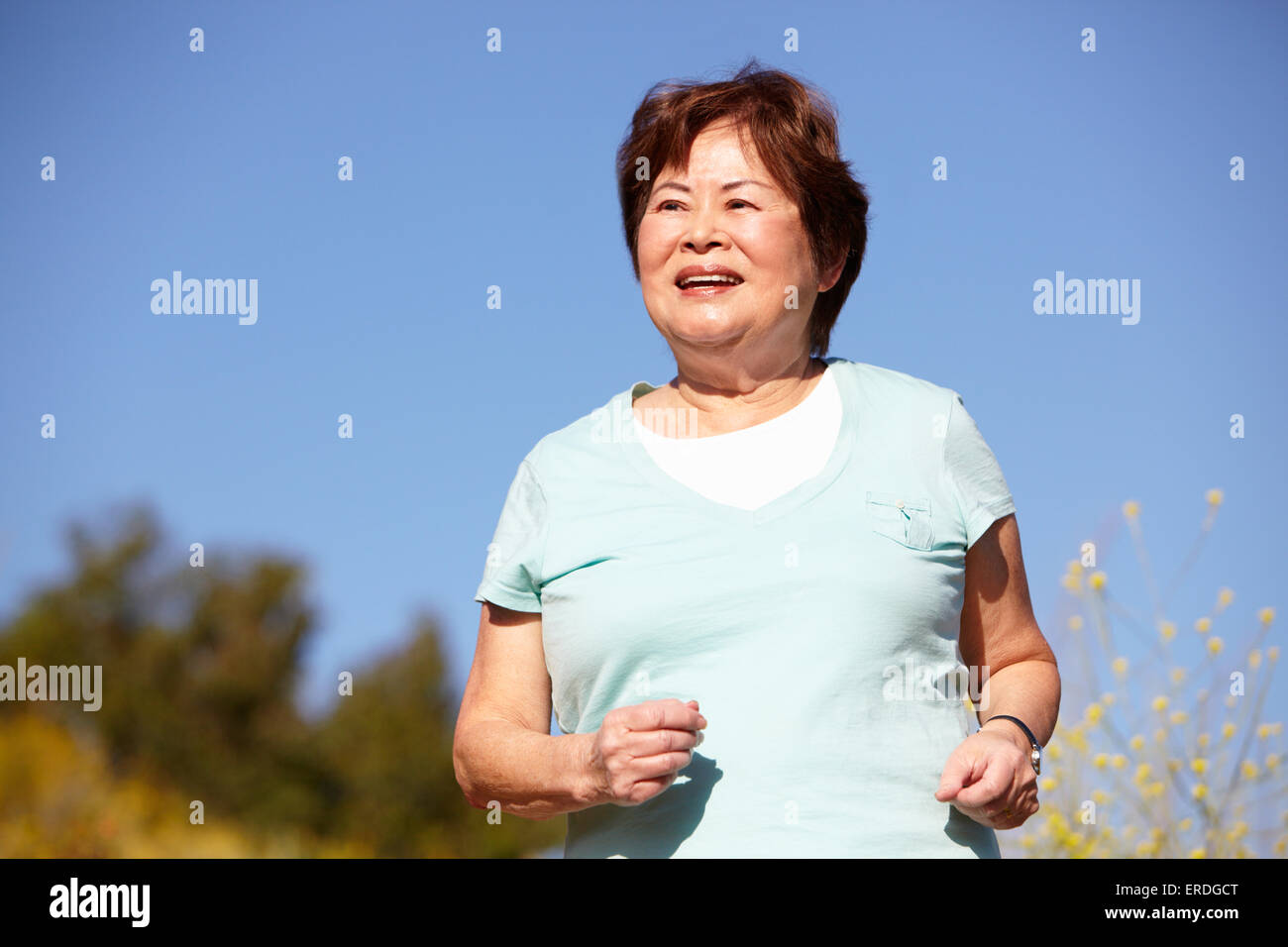 Senior woman jogging Stock Photo - Alamy