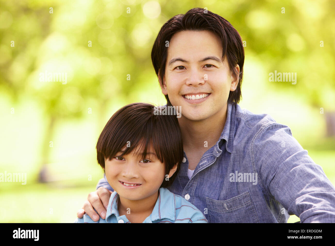 Filipino father son hugging sitting hi-res stock photography and images - Alamy