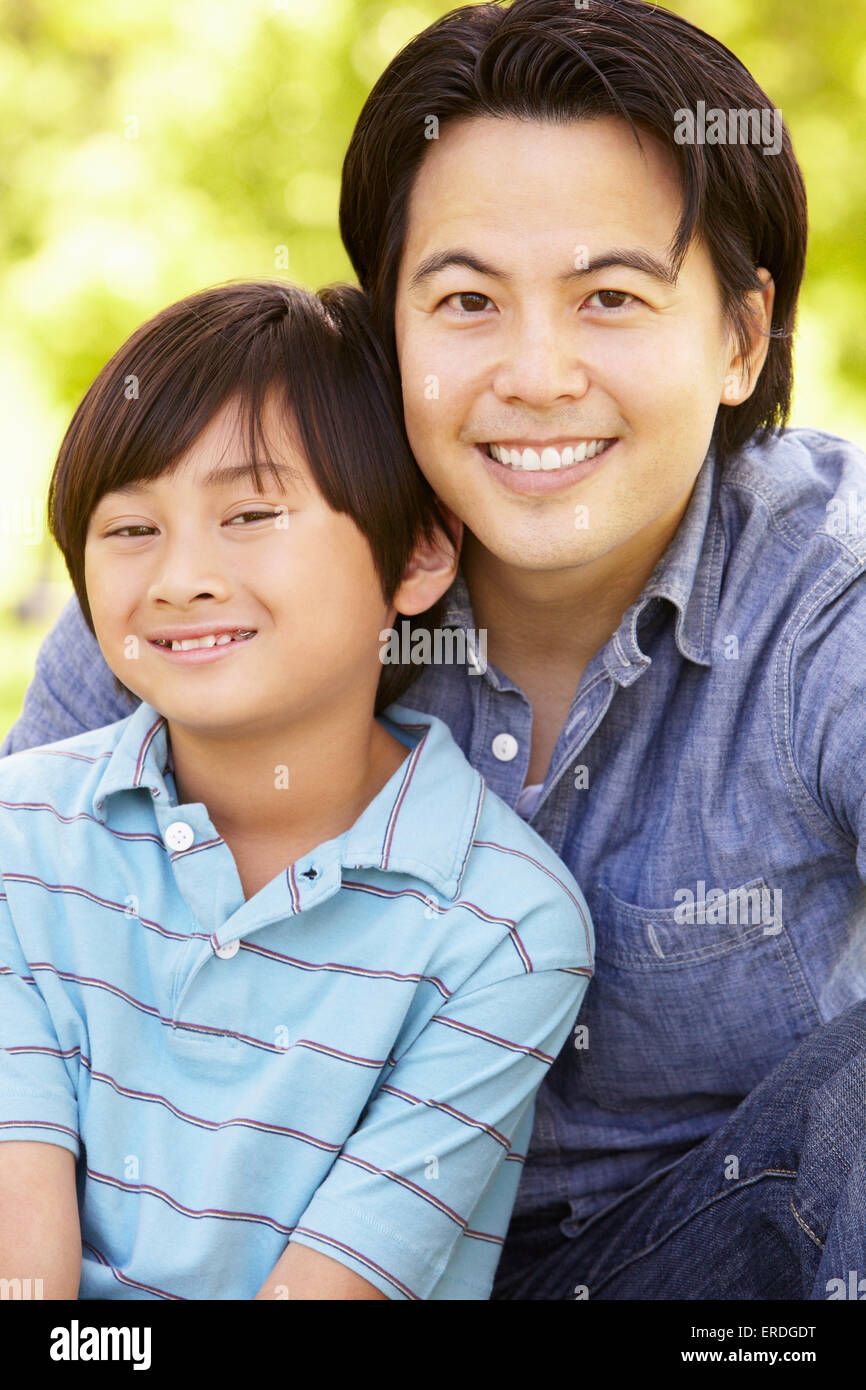 Filipino father son hugging sitting hi-res stock photography and images ...