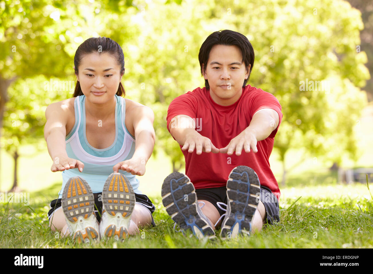 Asian couple exercising Stock Photo - Alamy