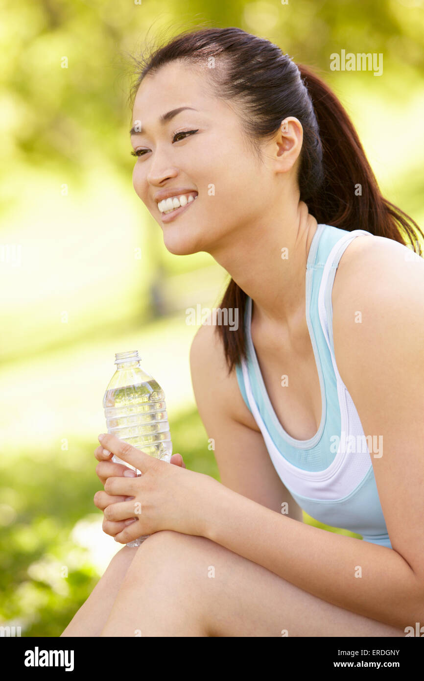 Asian woman resting after exercise Stock Photo - Alamy
