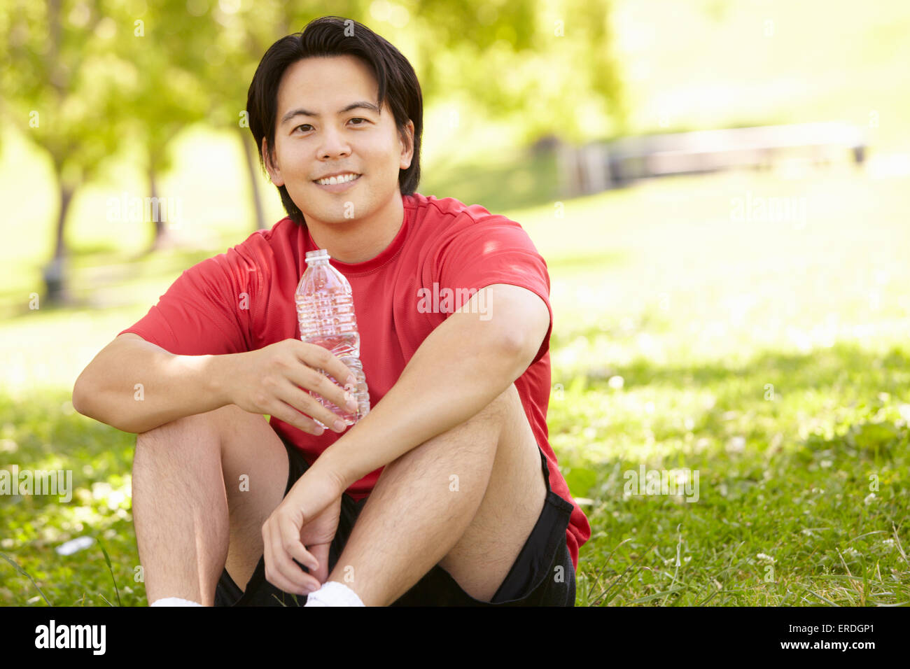 Asian man resting after exercise Stock Photo - Alamy