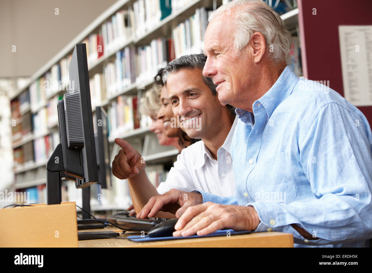 Students working on computers in library Stock Photo - Alamy