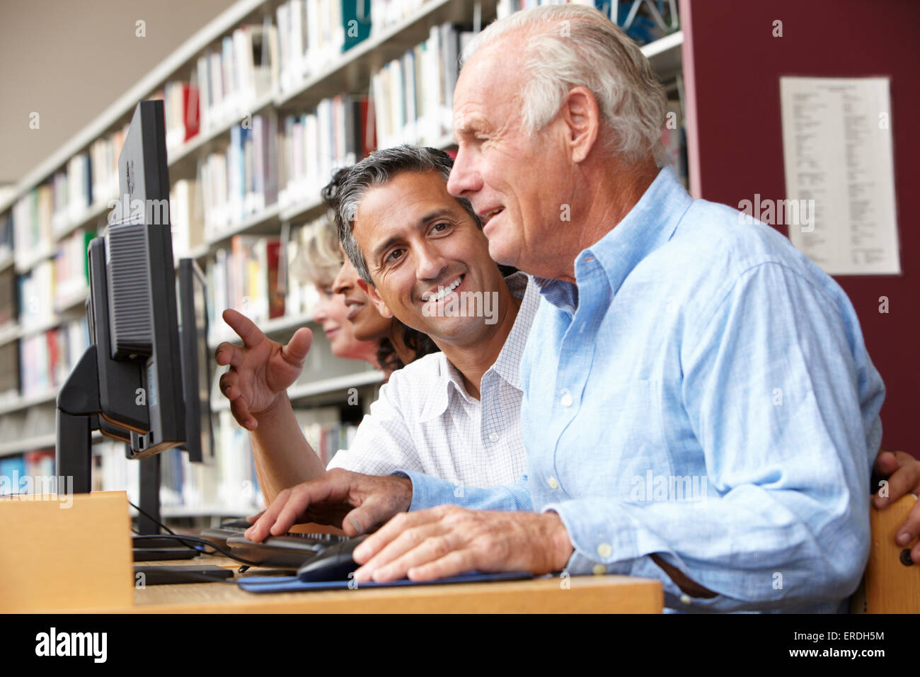 Students working on computers in library Stock Photo - Alamy
