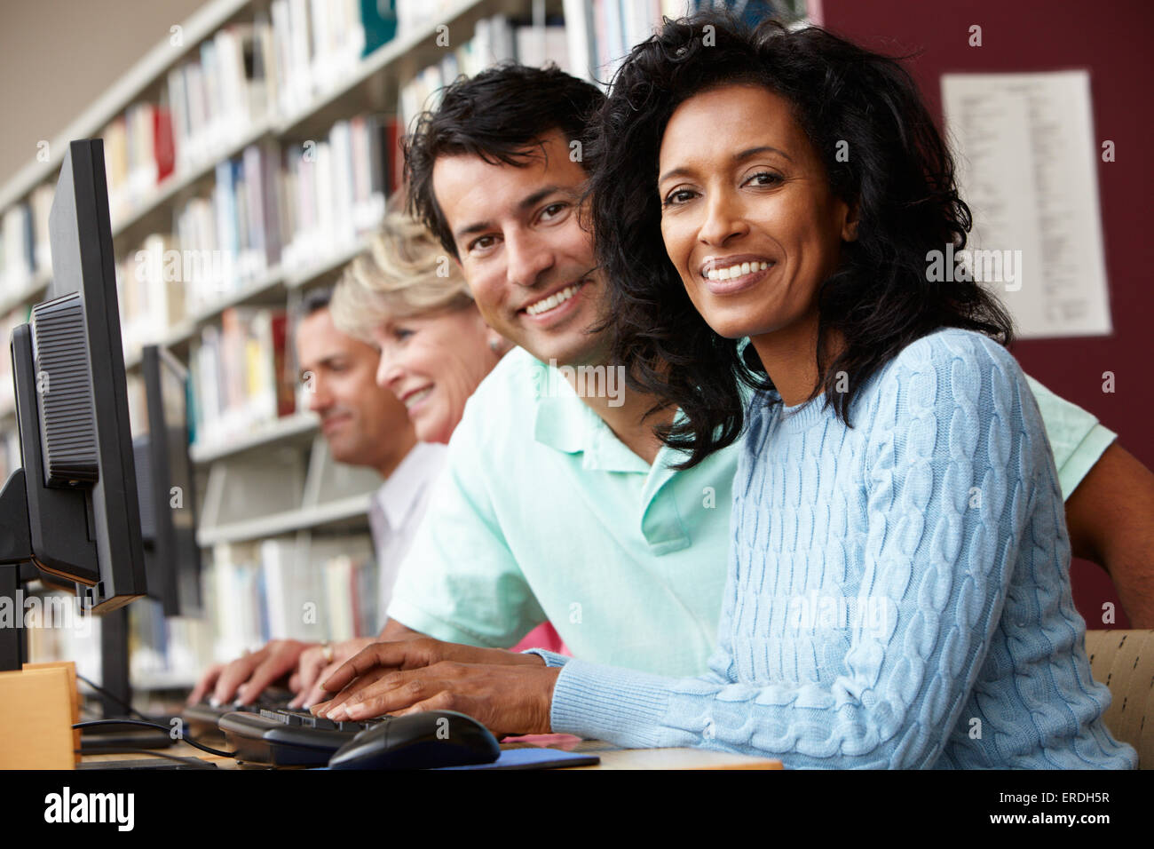 Students working on computers in library Stock Photo - Alamy