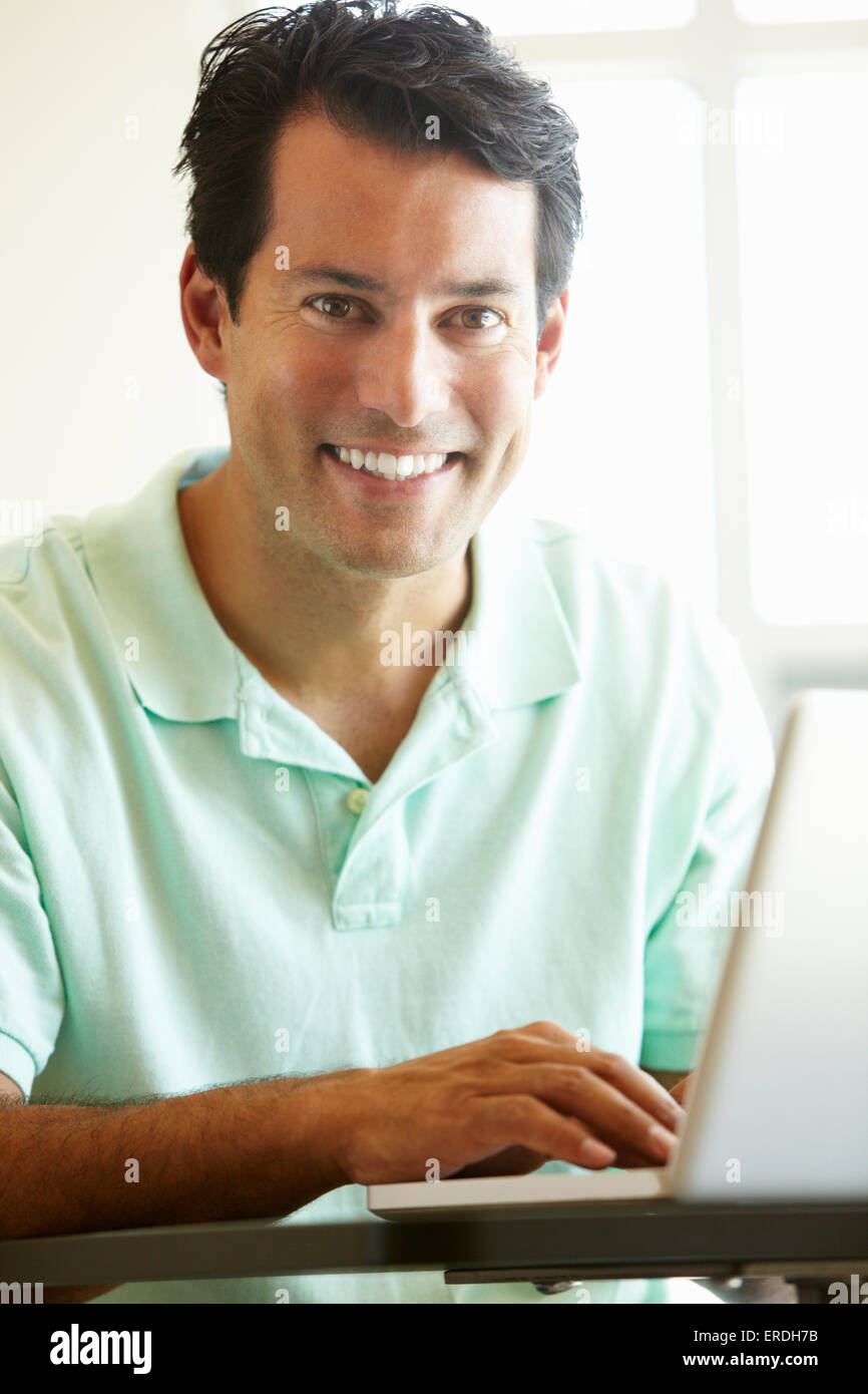 Mature student using computer in class Stock Photo - Alamy