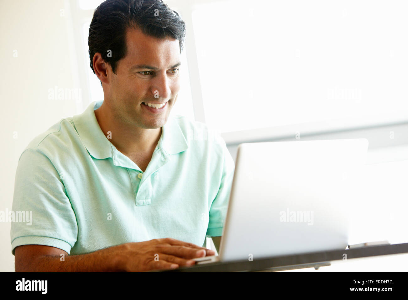 Mature student using computer in class Stock Photo - Alamy