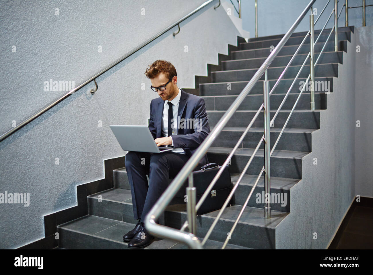 Businessman networking on stairs Stock Photo - Alamy