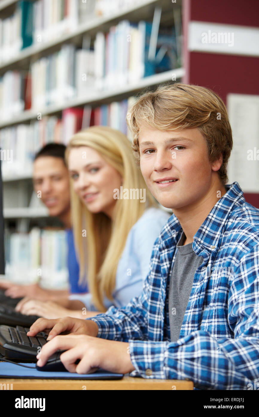 Teenagers working on computers in library Stock Photo - Alamy