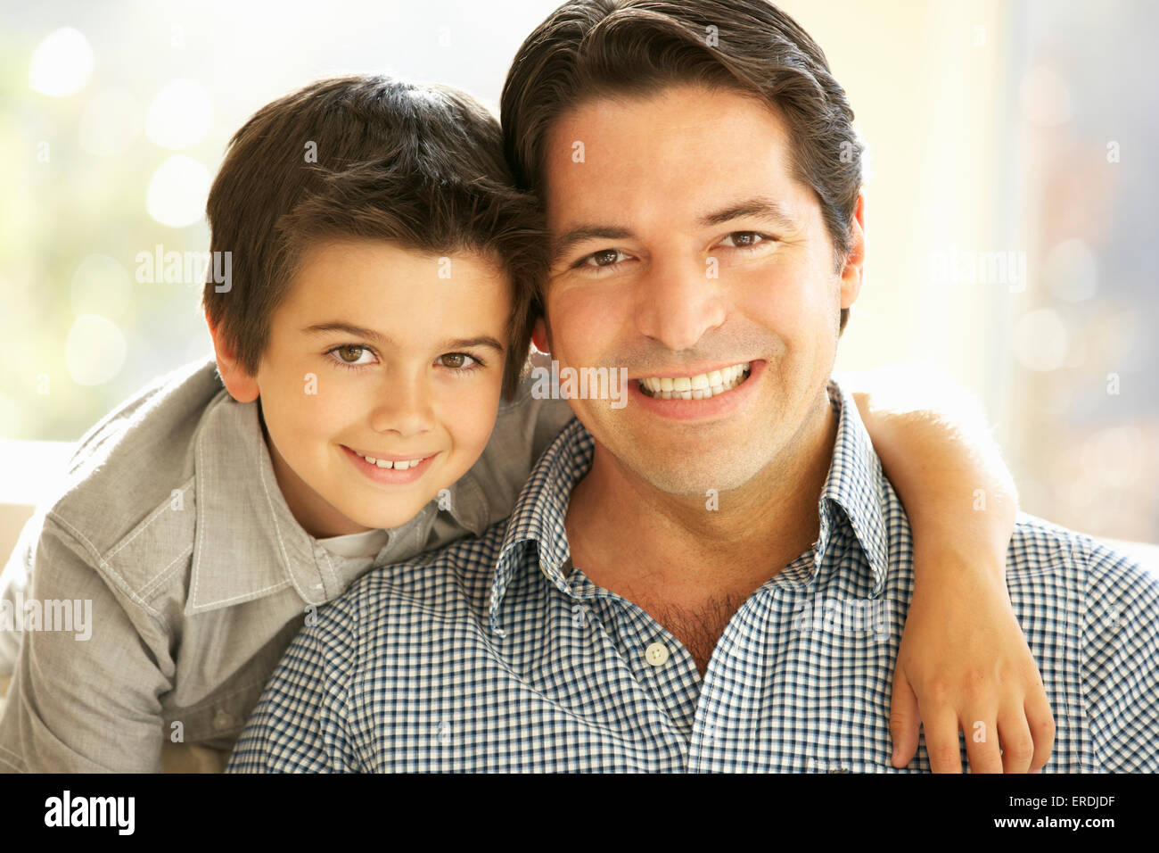 Portrait Of Hispanic Father And Son At Home Stock Photo - Alamy
