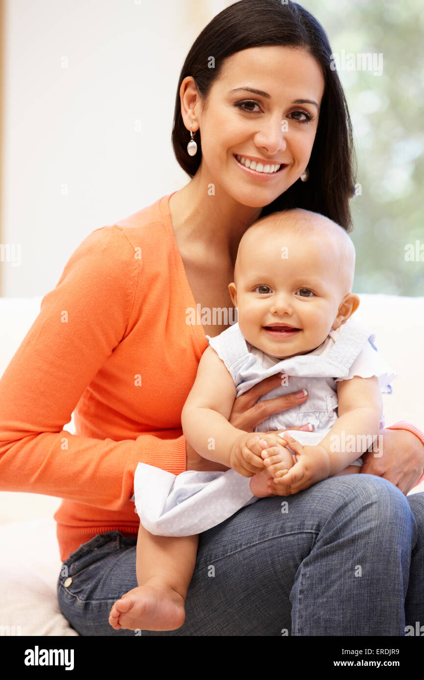 Hispanic mother and baby at home Stock Photo - Alamy