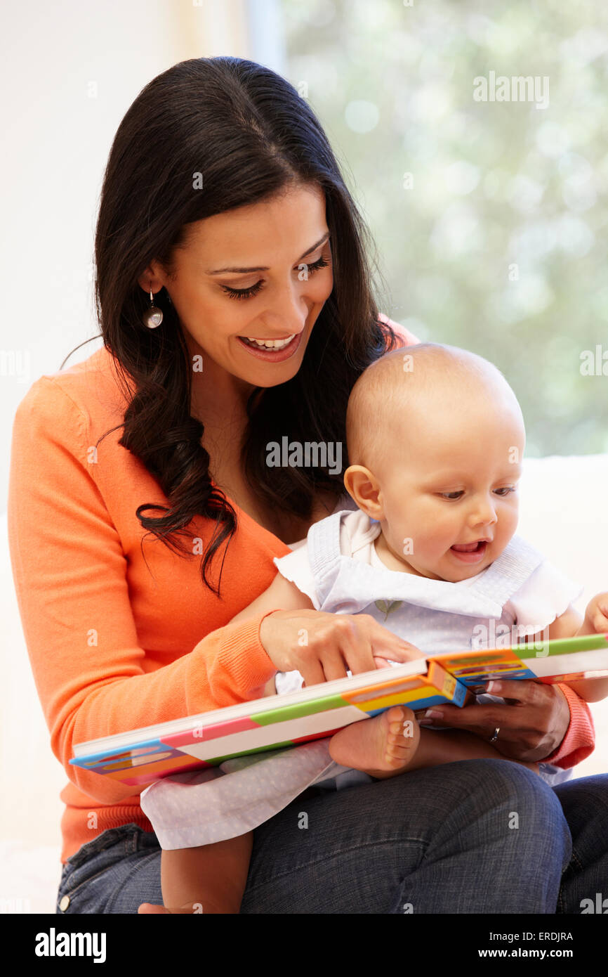 Hispanic mother and baby at home Stock Photo - Alamy