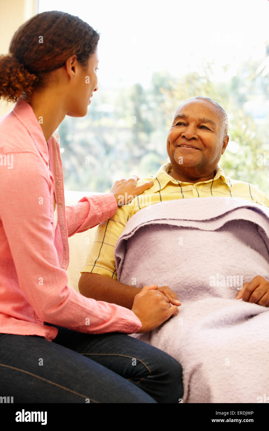 Woman looking after sick father Stock Photo - Alamy
