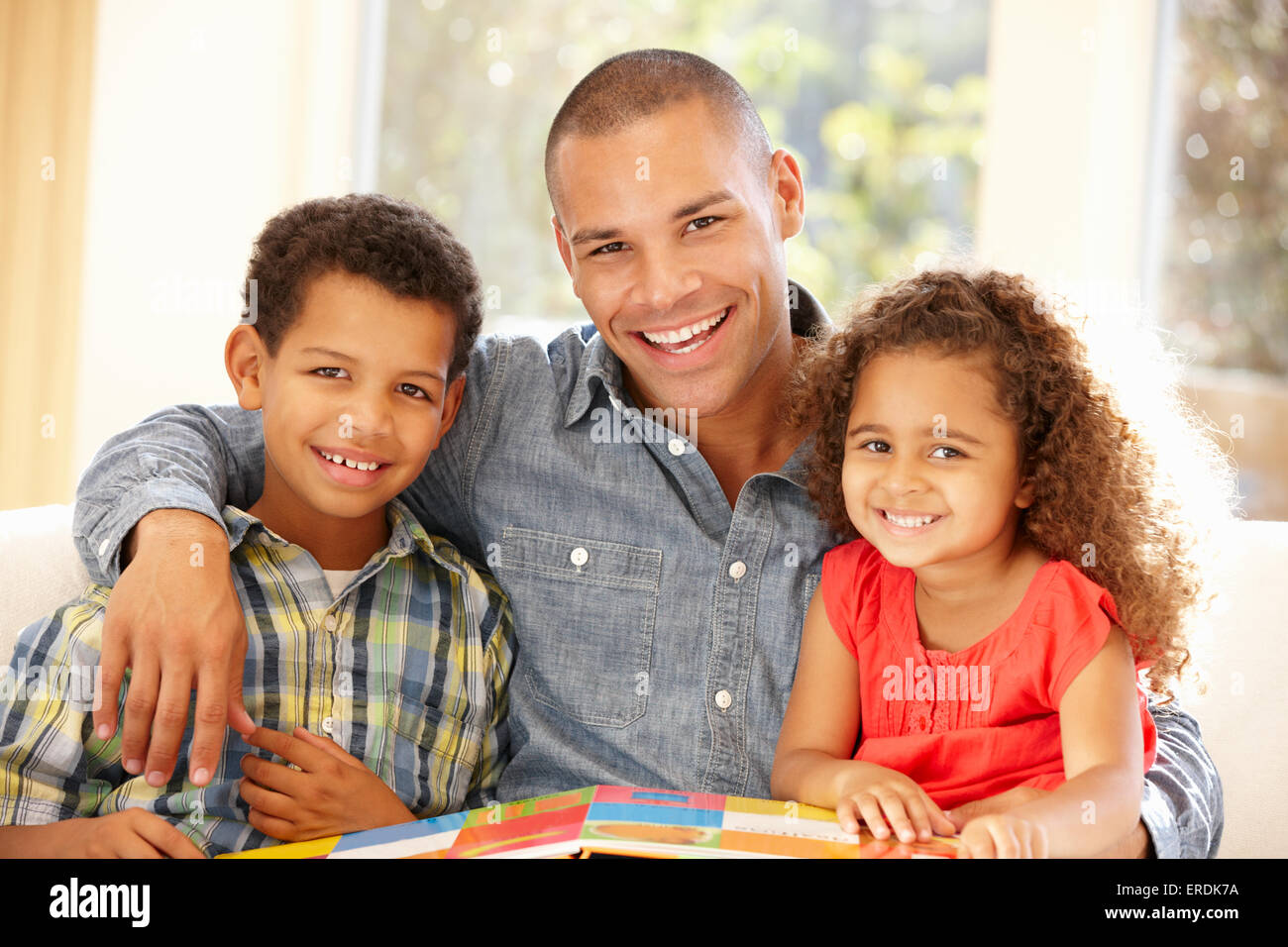 Father reading to children Stock Photo - Alamy
