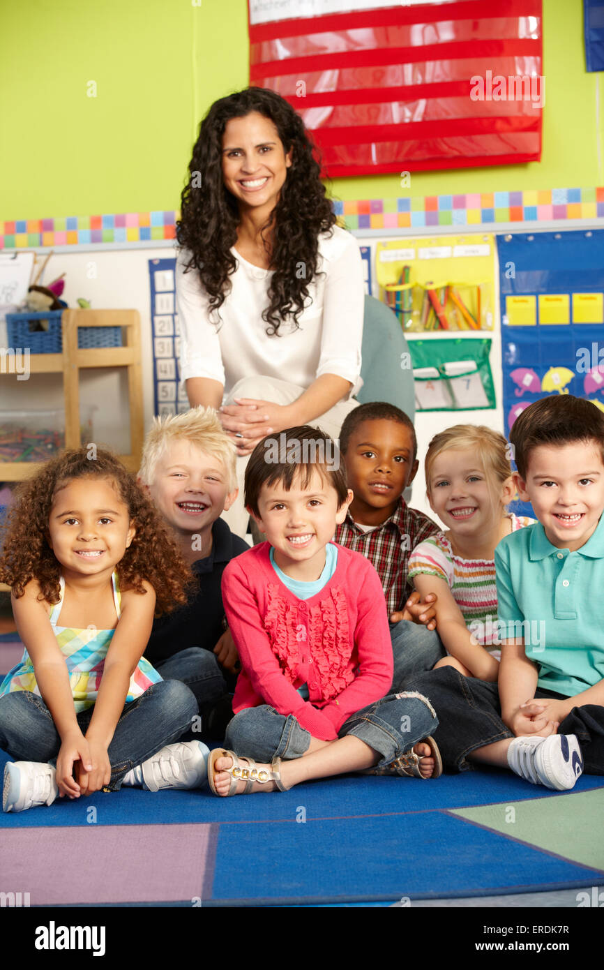 Group Of Elementary Age Schoolchildren In Class With Teacher Stock ...