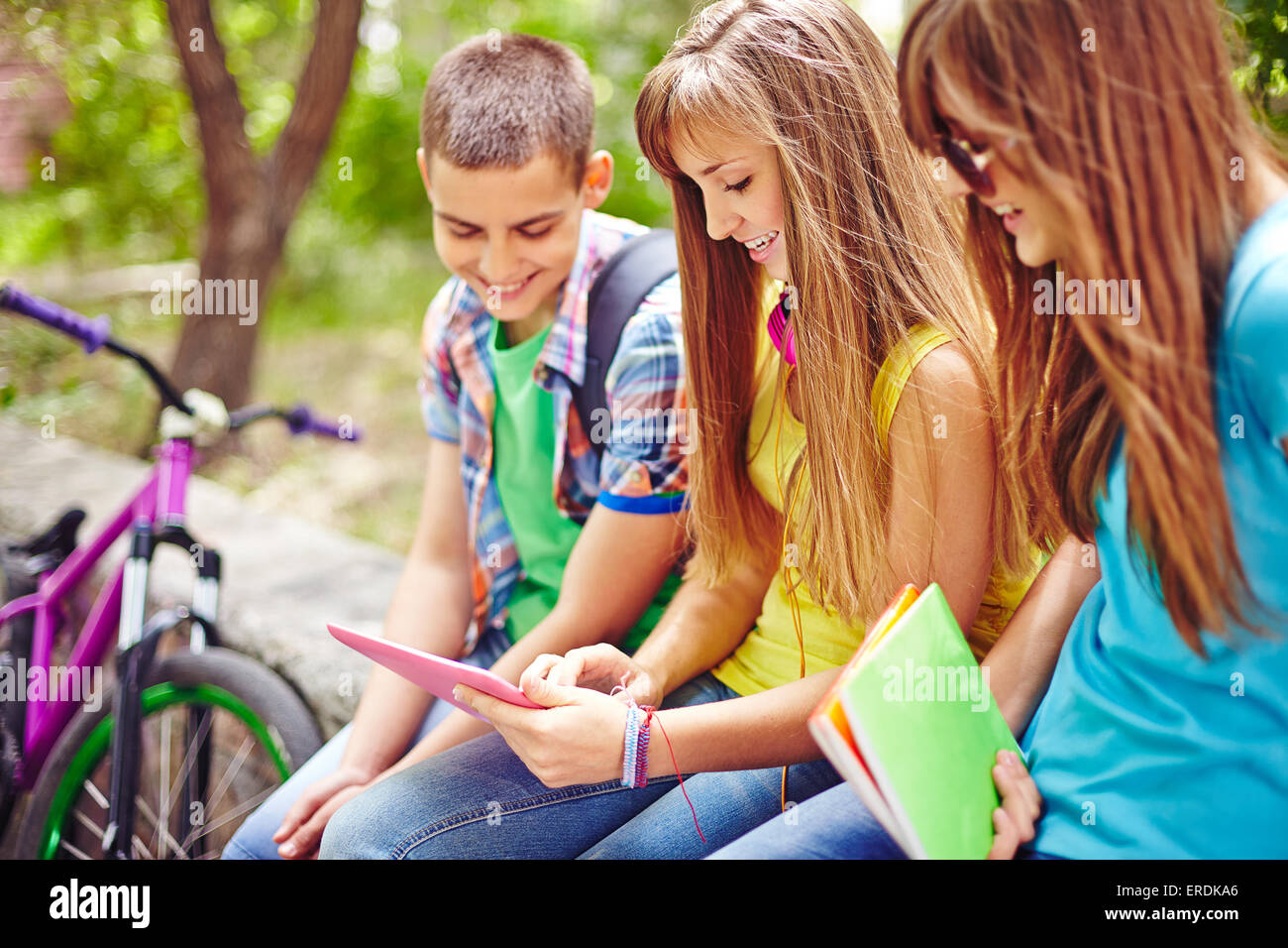 Modern teenagers browsing outside Stock Photo - Alamy