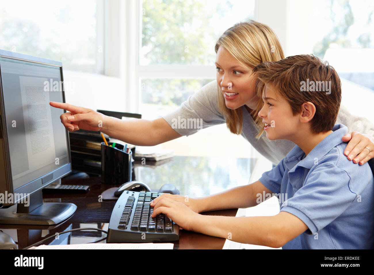 Mother and son using computer at home Stock Photo - Alamy Mother and son using computer at home Stock Photo - Alamy