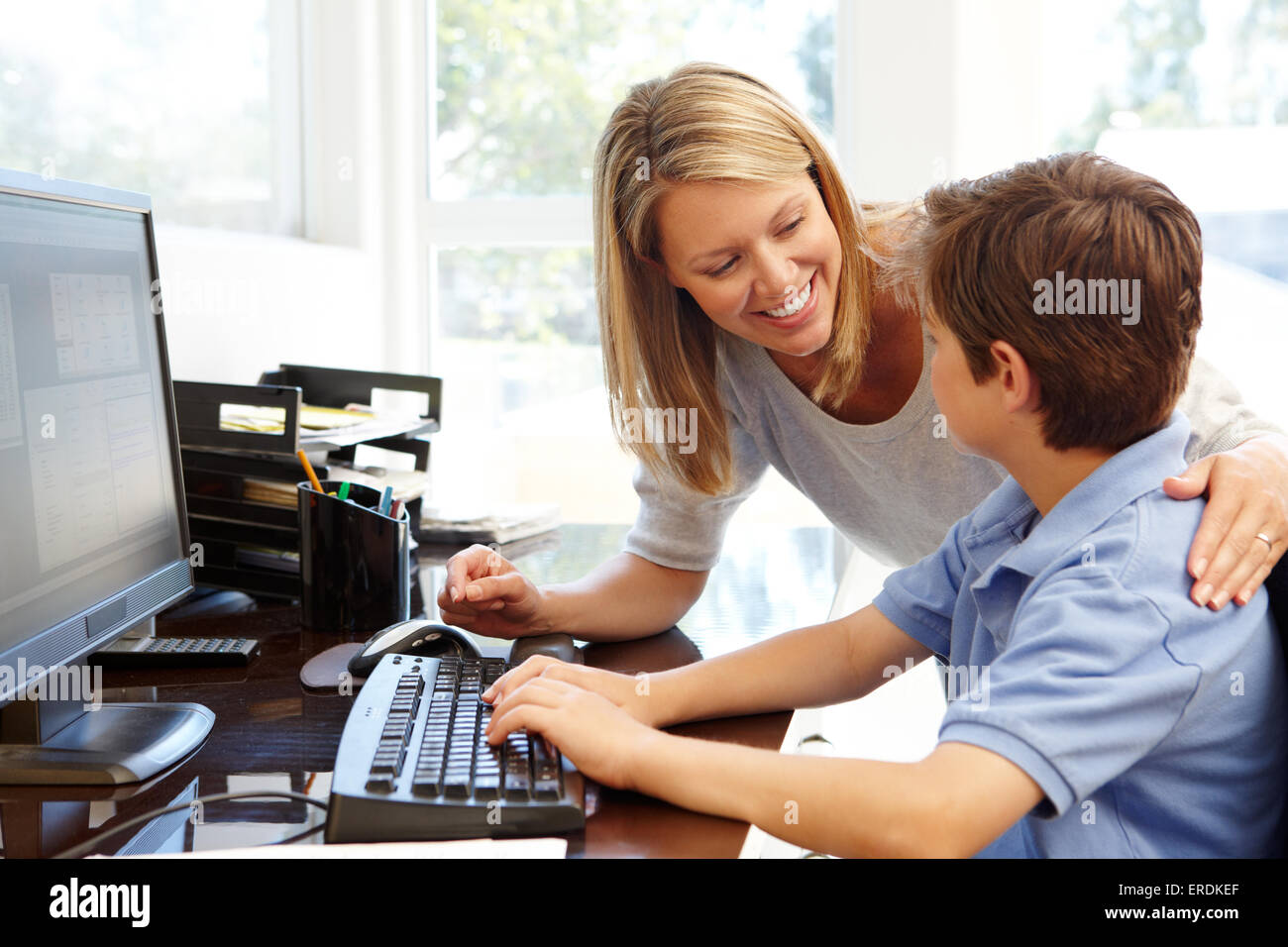 Mother and son using computer at home Stock Photo - Alamy Mother and son using computer at home Stock Photo - Alamy