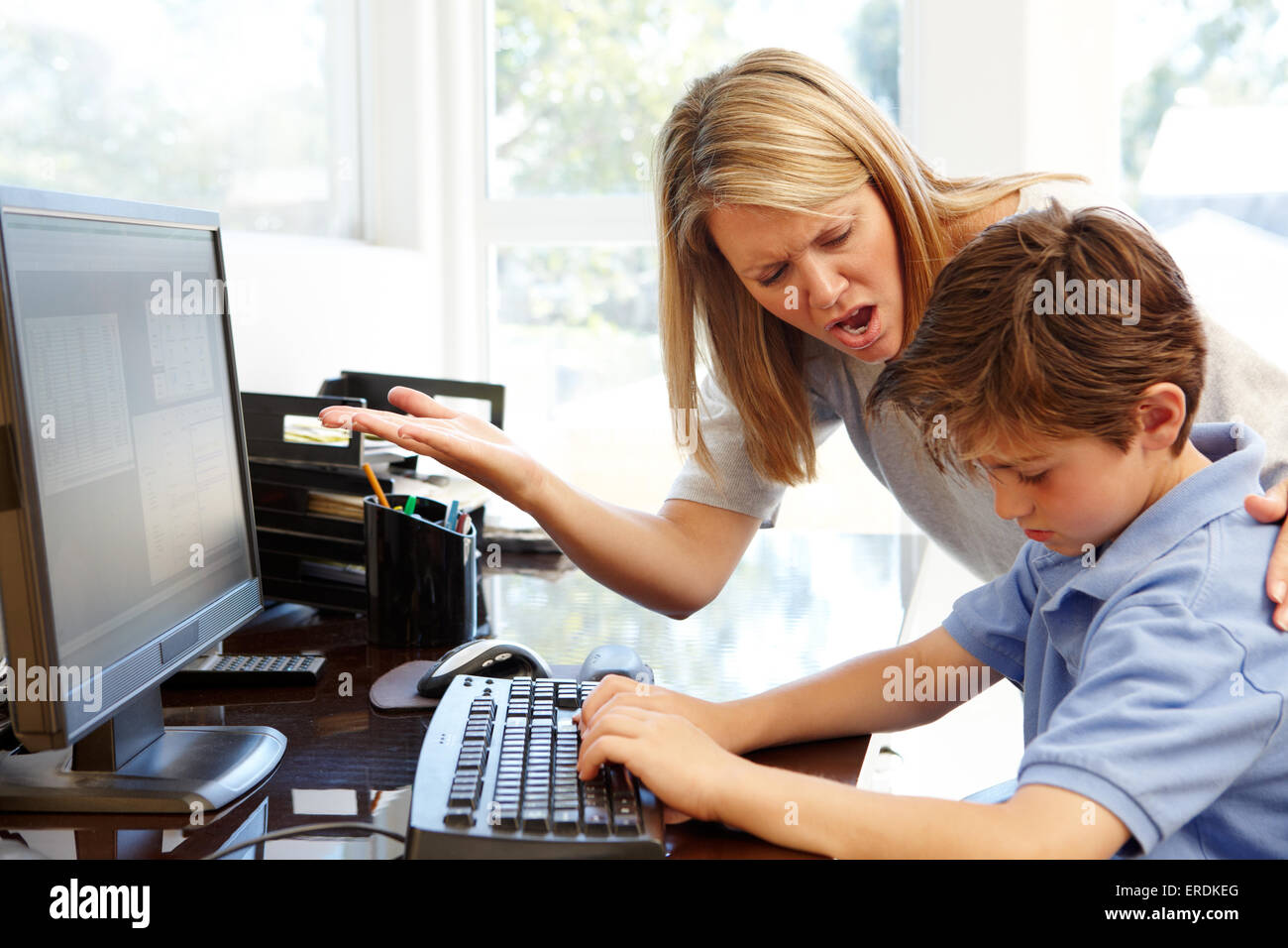 Mother and son using computer at home Stock Photo - Alamy