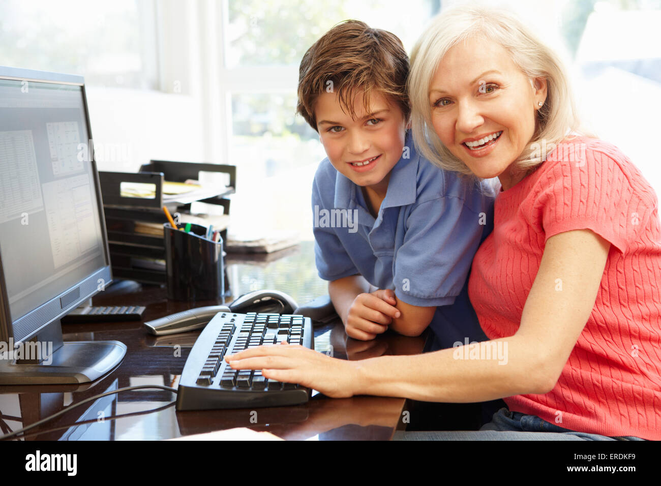 Woman using computer typing hi-res stock photography and images - Alamy