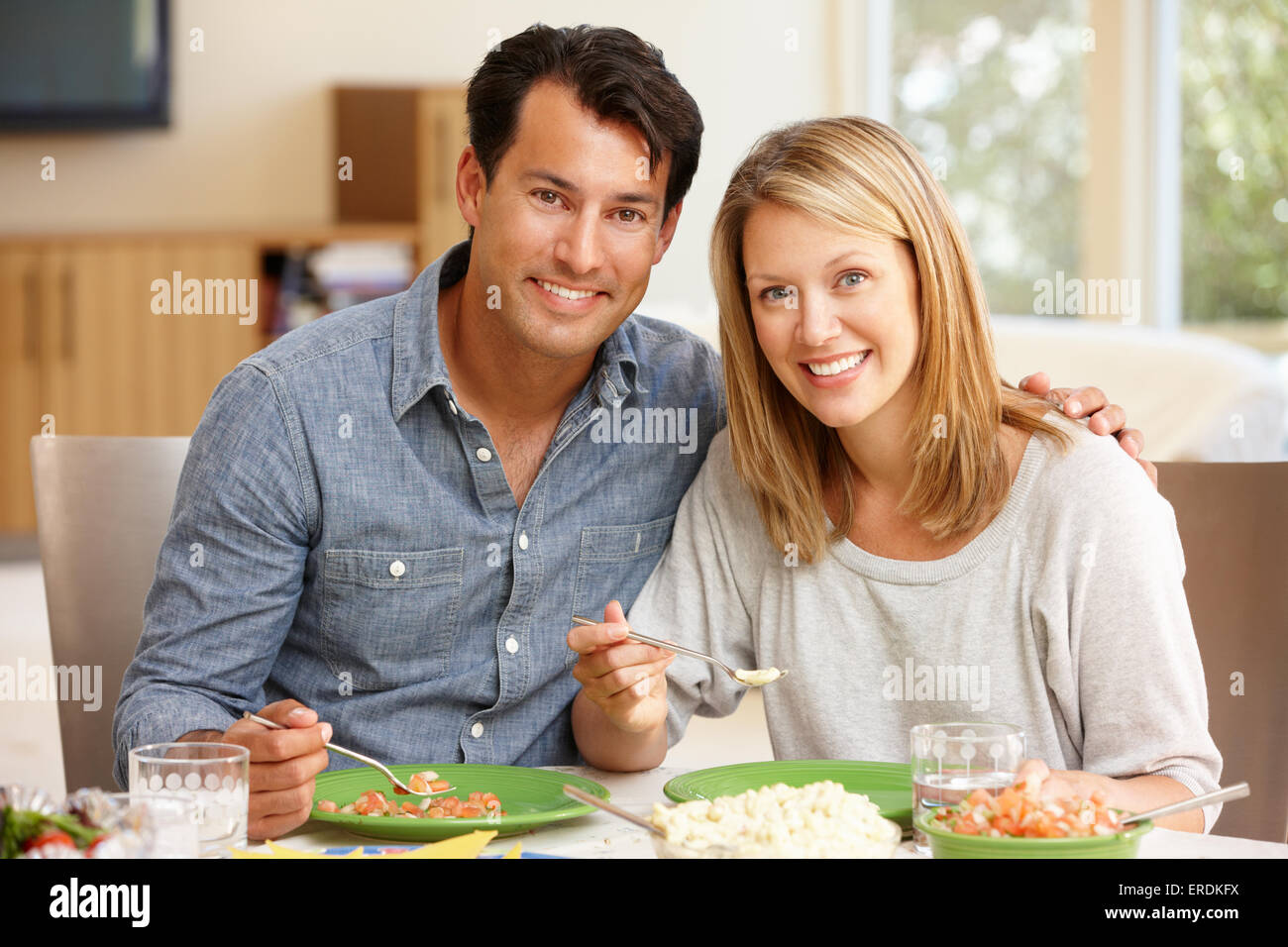 Couple sharing meal Stock Photo - Alamy