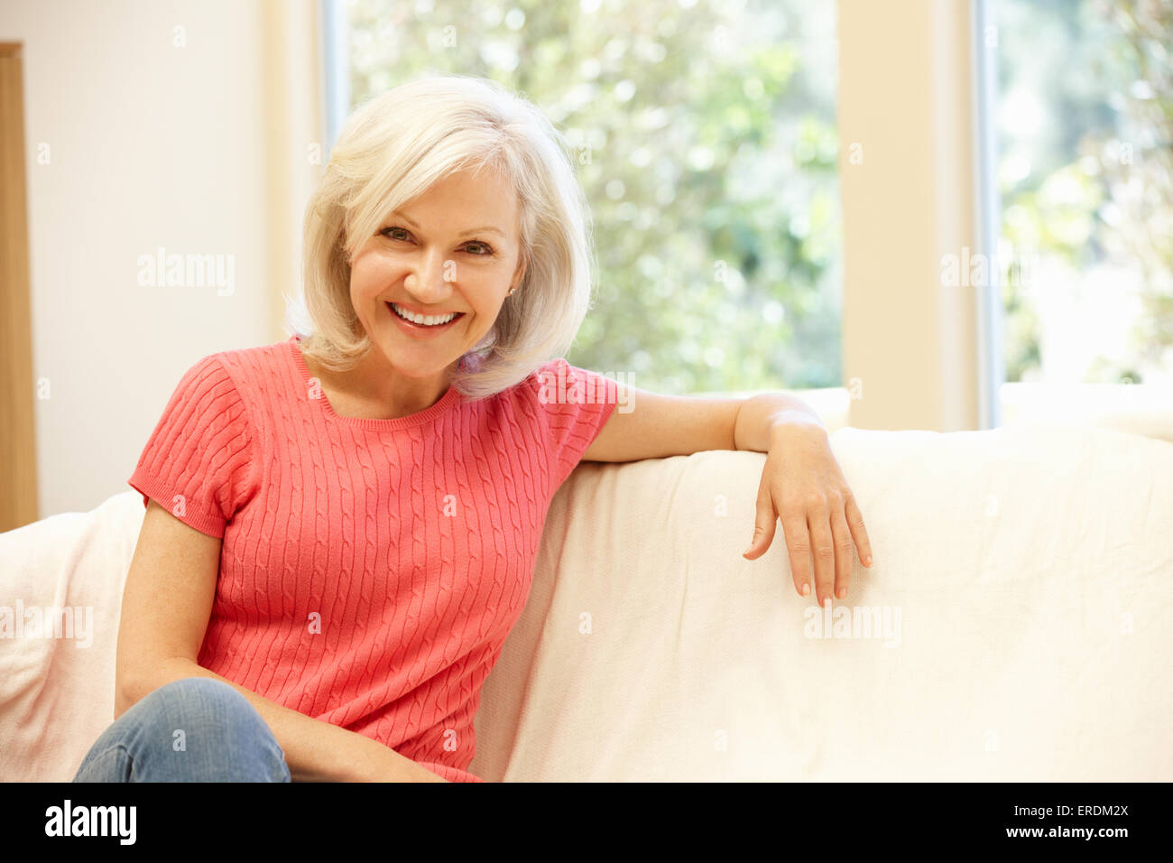 Mid age woman at home Stock Photo - Alamy