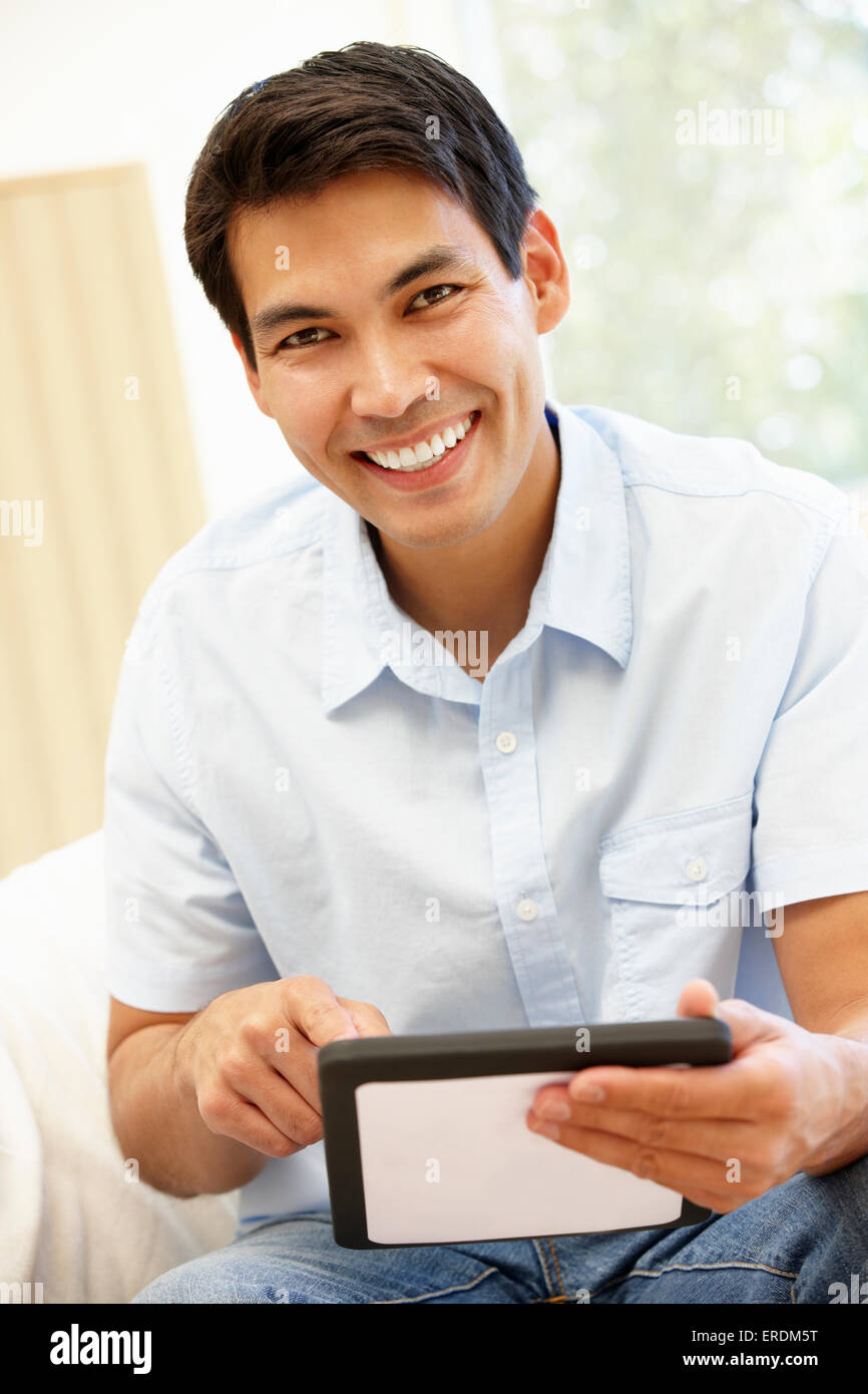 Asian man using tablet Stock Photo - Alamy
