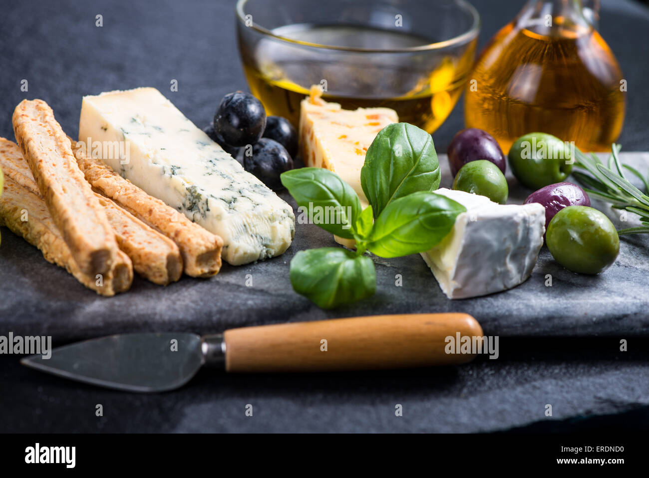 Tapas board with cheese,olives,grapes and red wine,food border ...