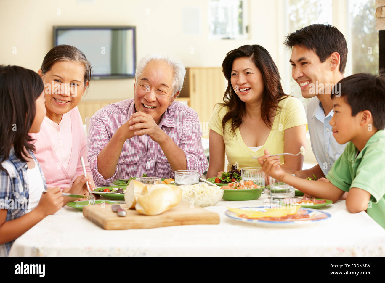 Asian family sharing meal at home Stock Photo - Alamy