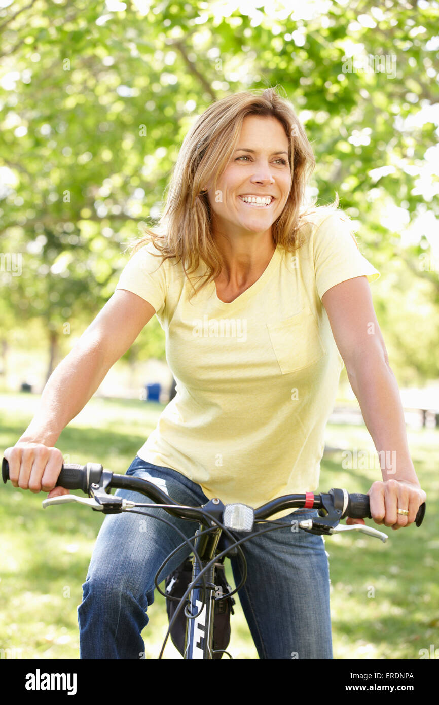 Woman riding bike Stock Photo - Alamy