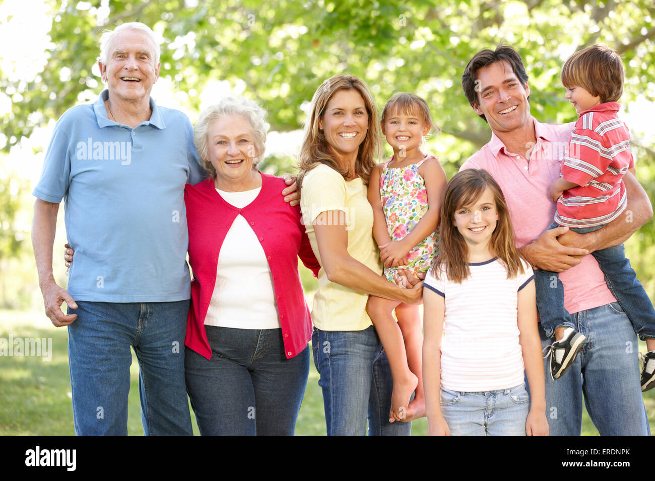 Multi-generation family in park Stock Photo - Alamy