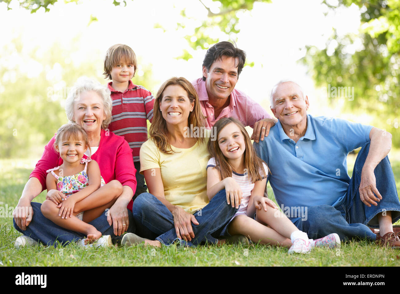 Multi-generation family in park Stock Photo - Alamy