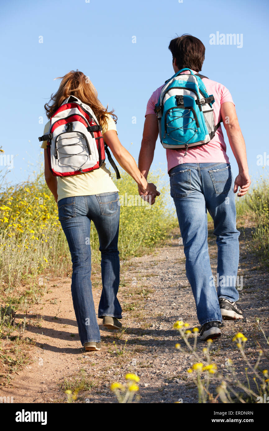 Couple on country walk Stock Photo - Alamy