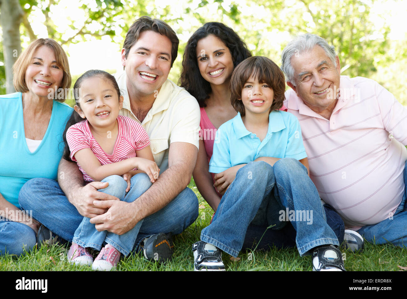 Multi Generation Hispanic Family Standing In Park Stock Photo - Alamy