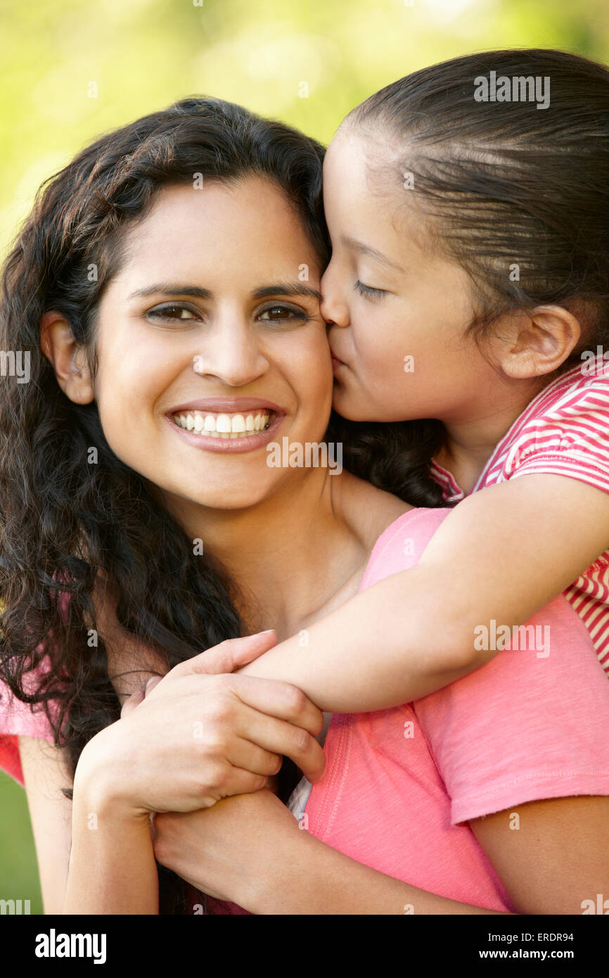 Hispanic Mother And Daughter Relaxing In Park Stock Photo - Alamy