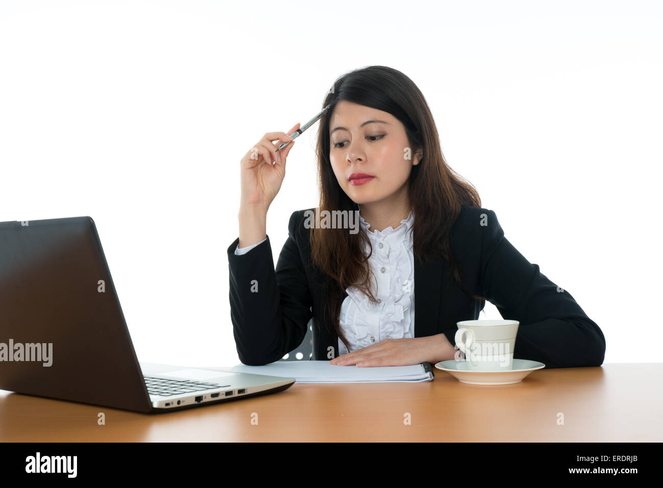 Businesswoman Sitting At Office Desk Writing and Thinking Stock Photo ...