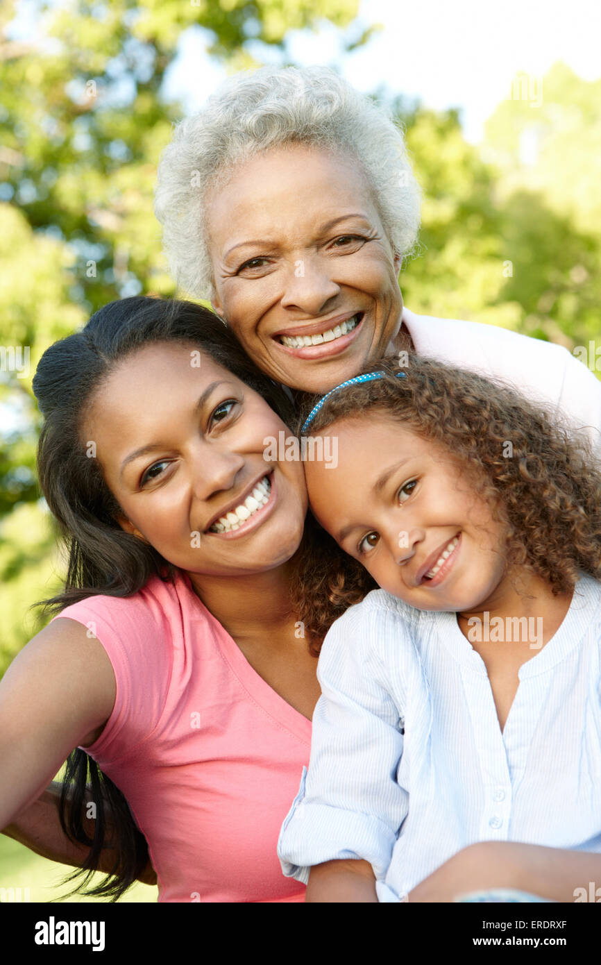 African American Grandmother, Mother And Daughter Relaxing In Park ...