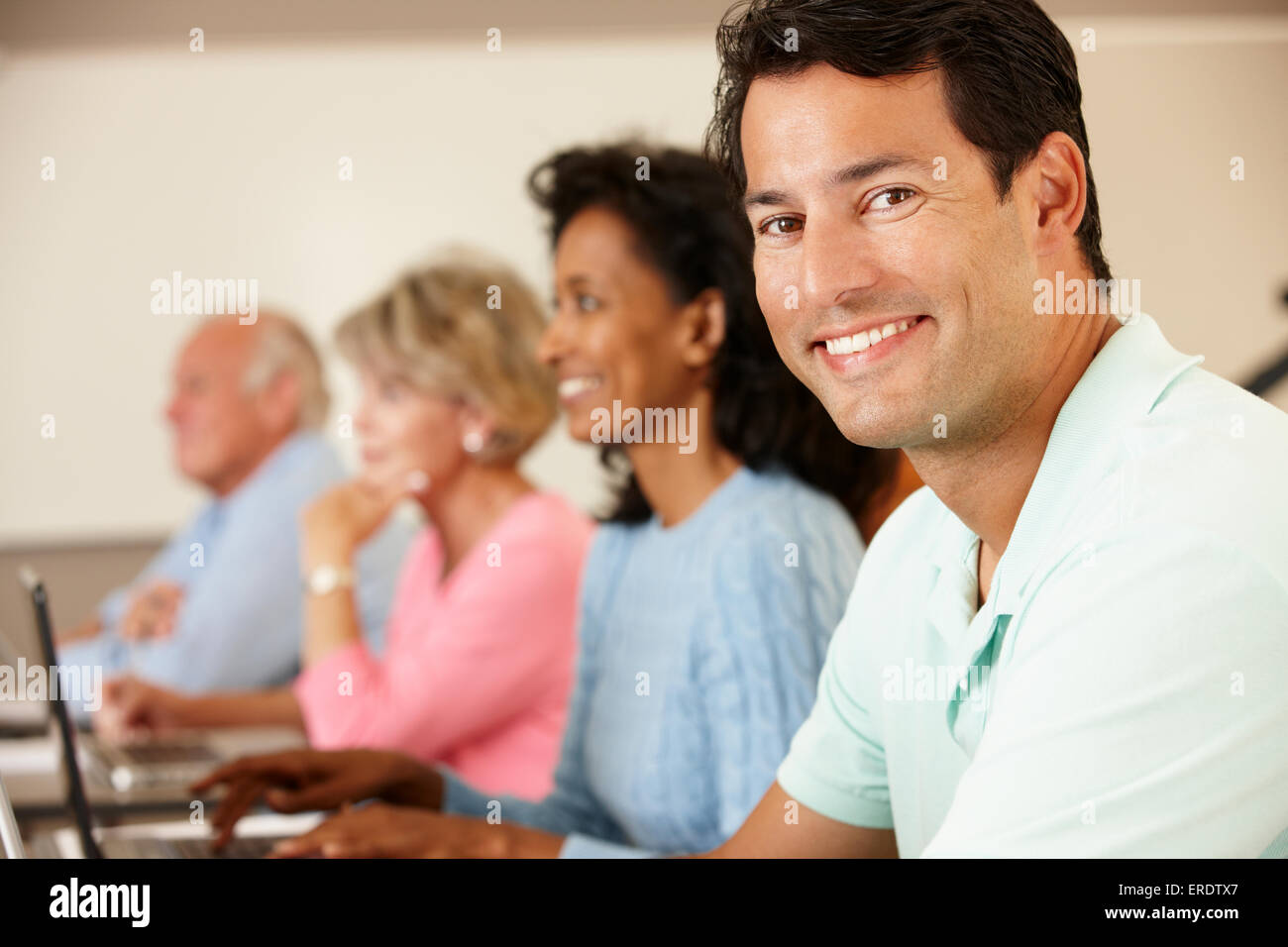 Mature student in class Stock Photo - Alamy